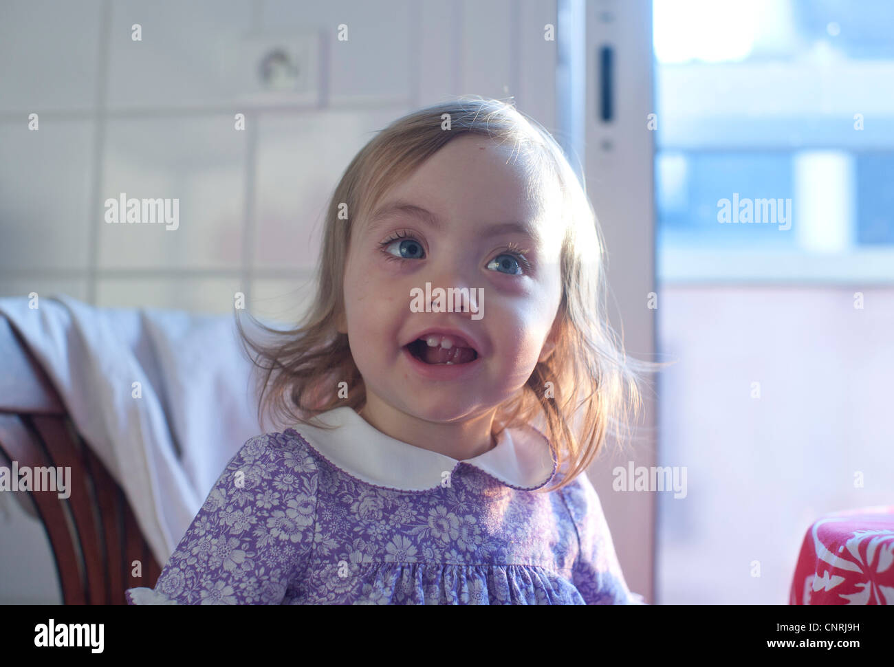 Toddler girl with cheerful expression, portrait Stock Photo - Alamy