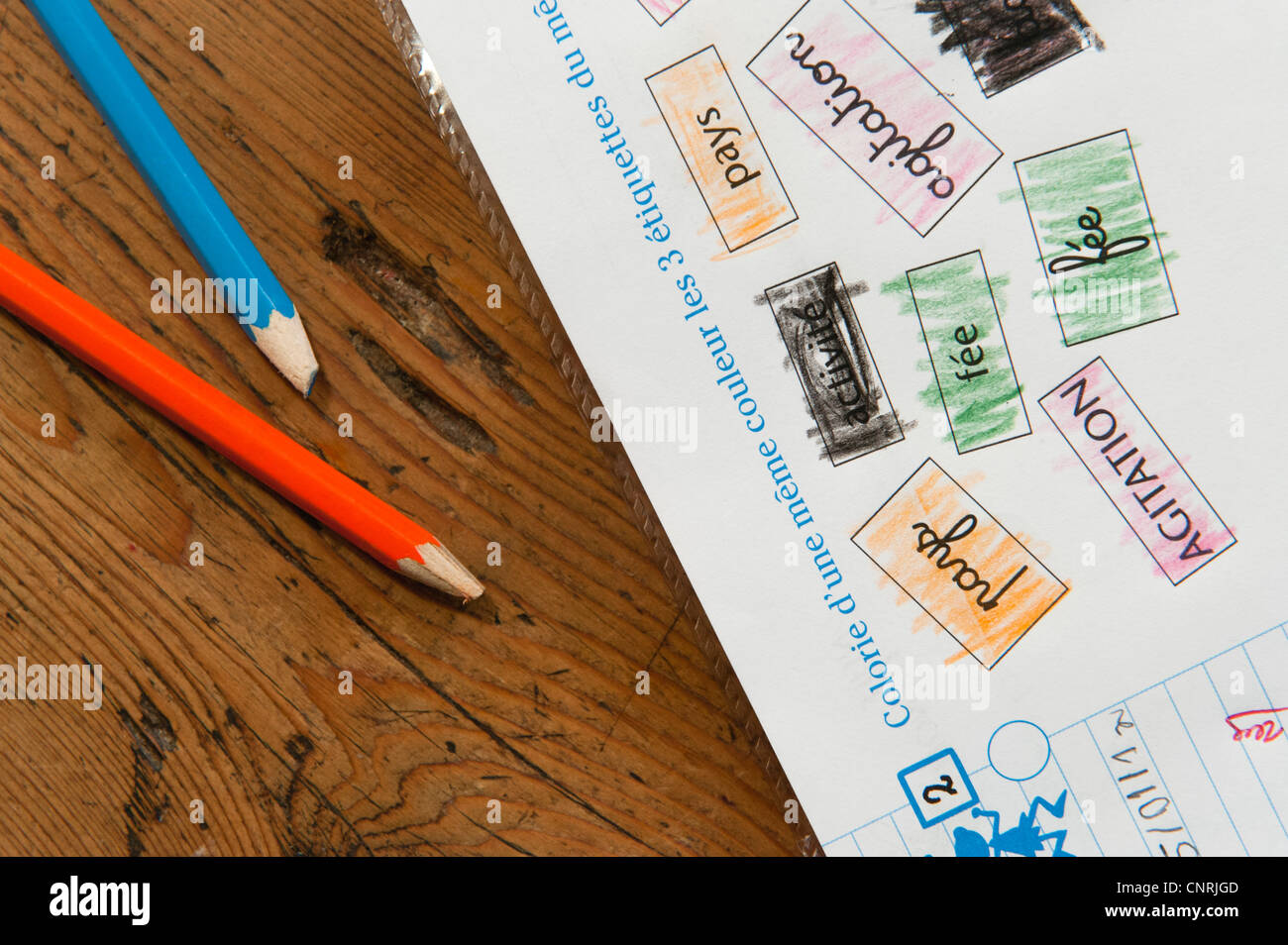 Child's homework and colored pencils Stock Photo - Alamy