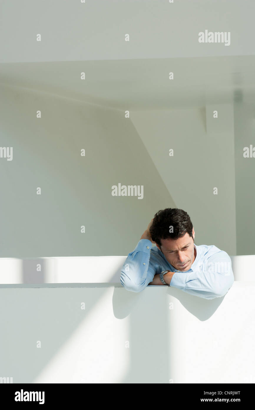 Mature man looking downward Stock Photo - Alamy