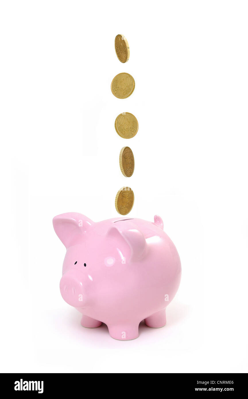Piggy bank coins Stock Photo - Alamy
