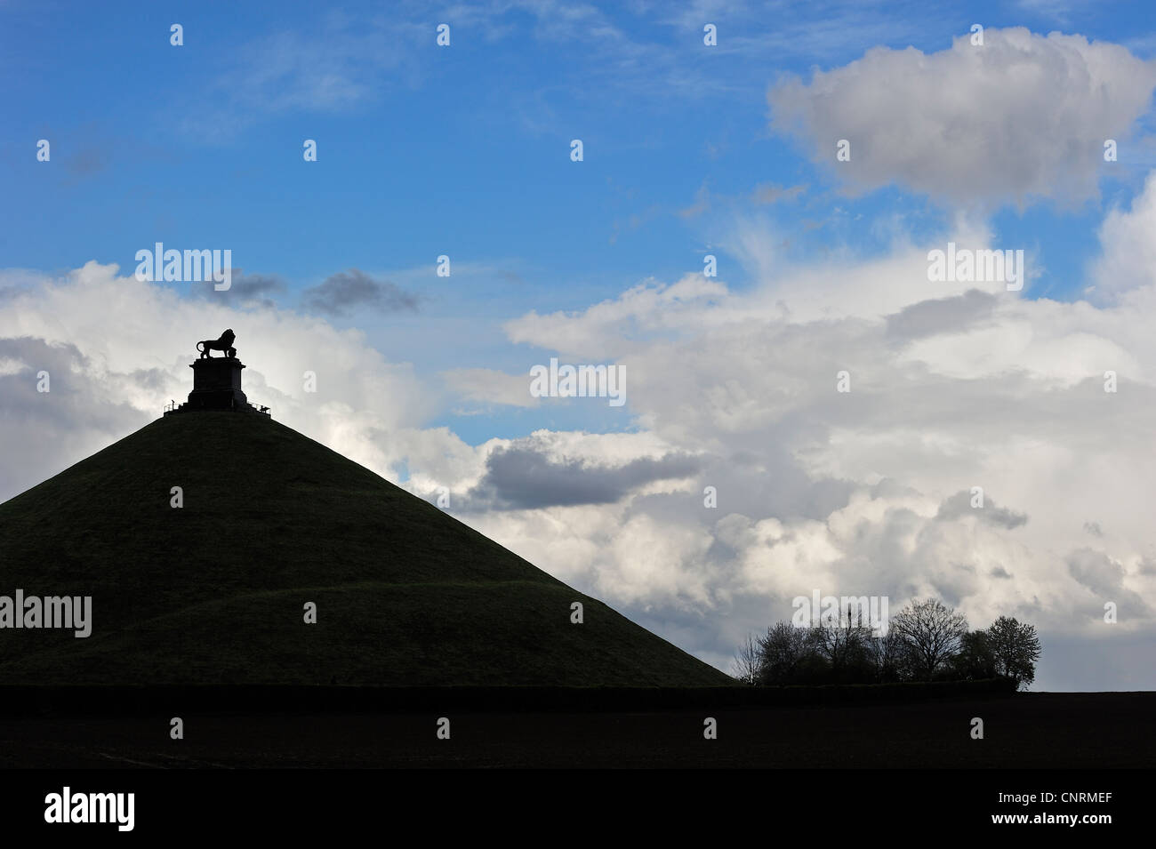 Lion Hill silhouetted against cloudy sky, memorial monument of the 1815 ...