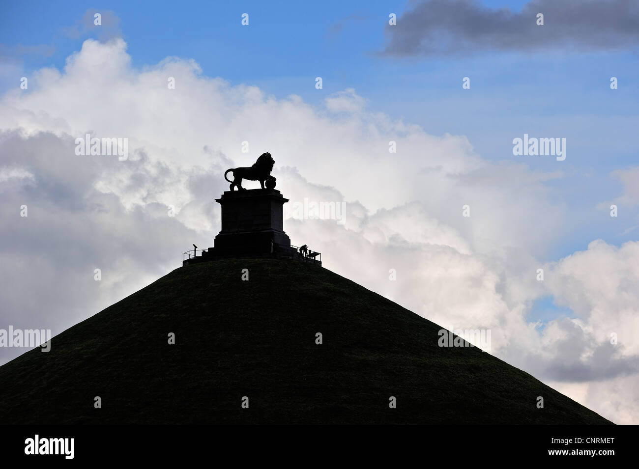 Lion Hill silhouetted against cloudy sky, memorial monument of the 1815 ...