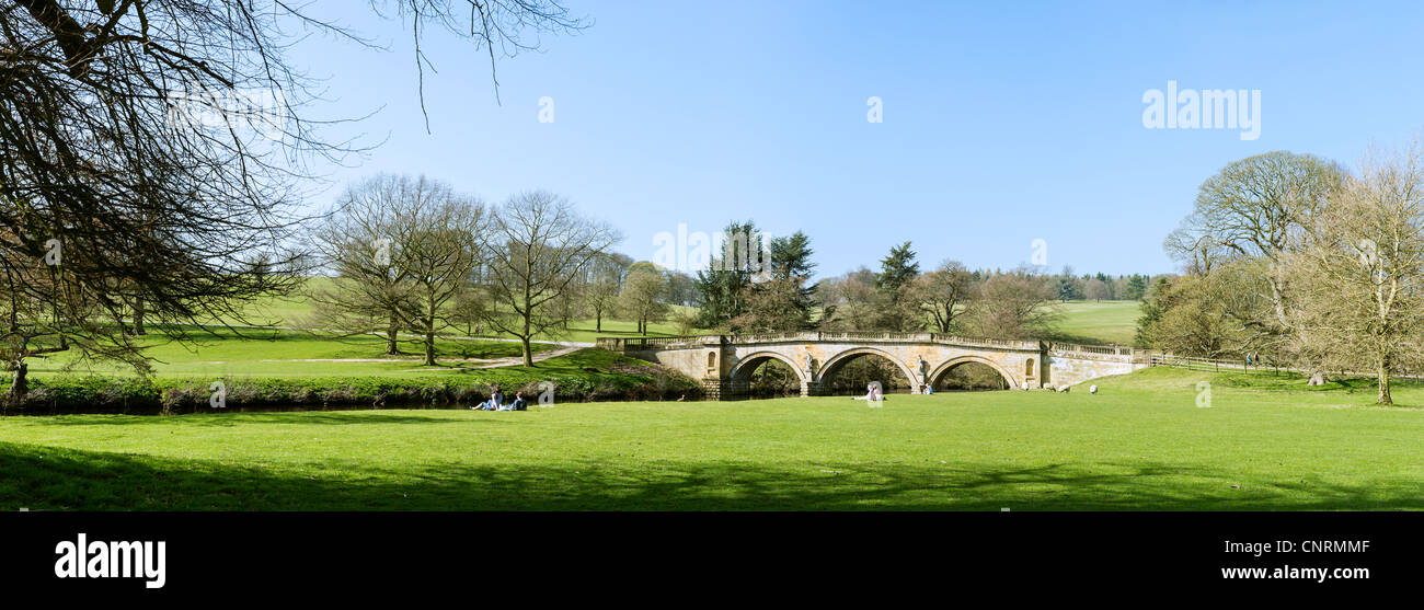 Parkland abording the river at Chatsworth House, Peak District, England ...
