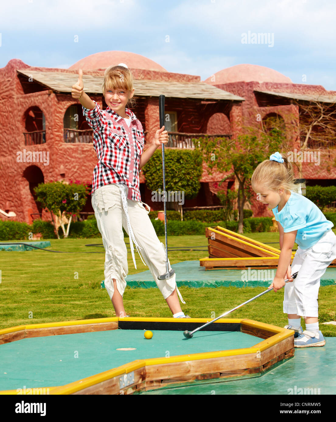Children playing golf Stock Photo - Alamy