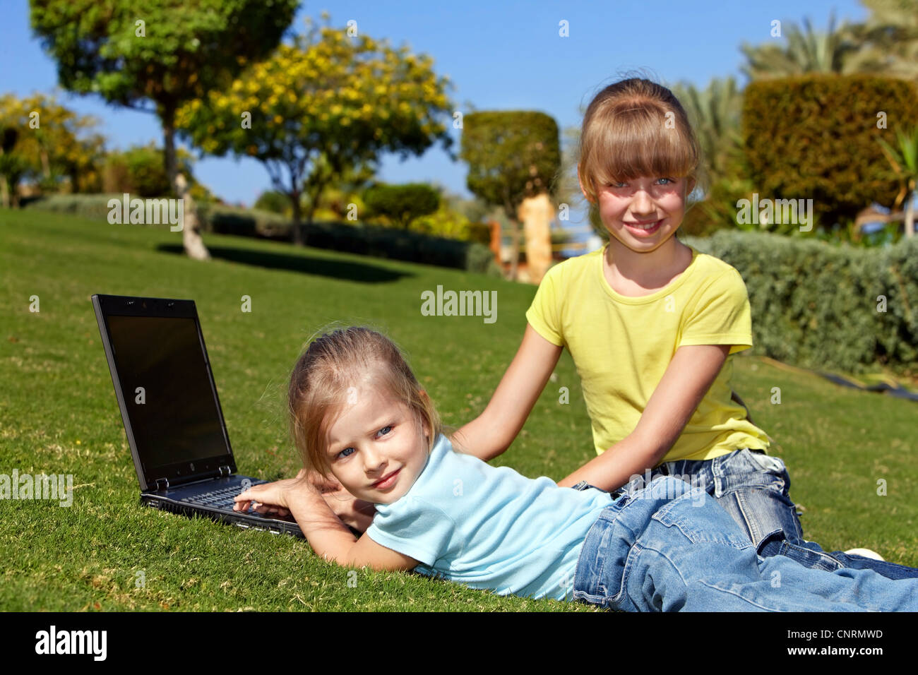 Children with laptop outdoor Stock Photo - Alamy