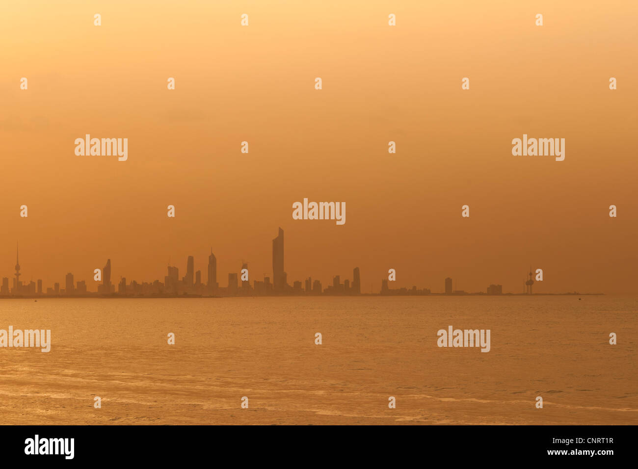 Kuwait City skyline at sunset with many major landmarks identifiable ...