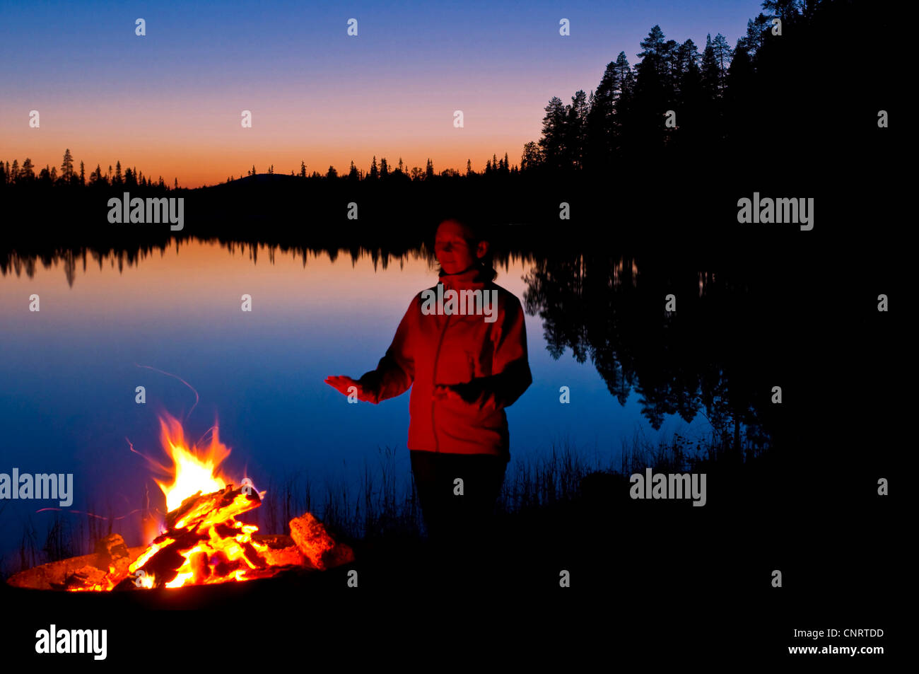 Silhouetted woman fire hi-res stock photography and images - Alamy