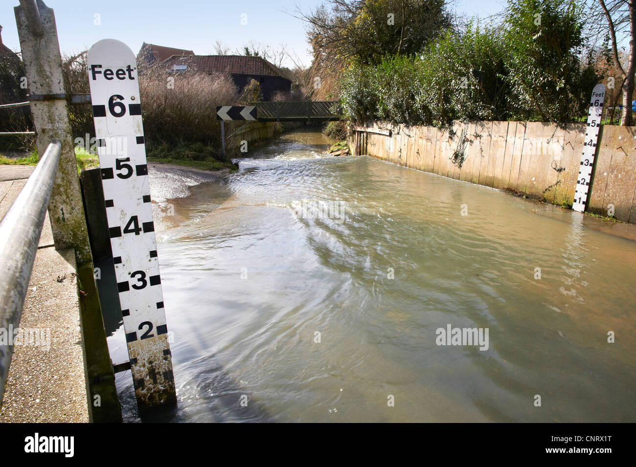 A ford across a road in low water conditions showing the black and ...