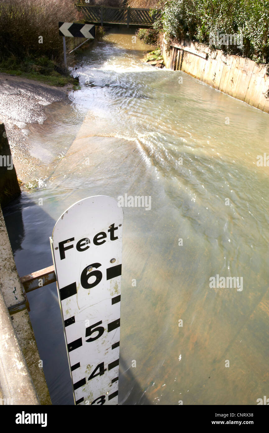 A ford across a road with low water conditions showing the black and ...