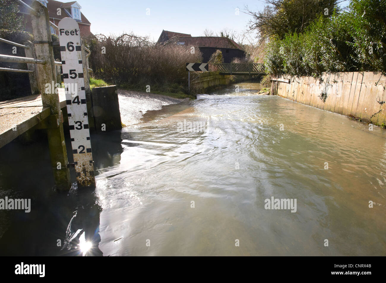 A ford across a road in low water conditions showing the black and ...