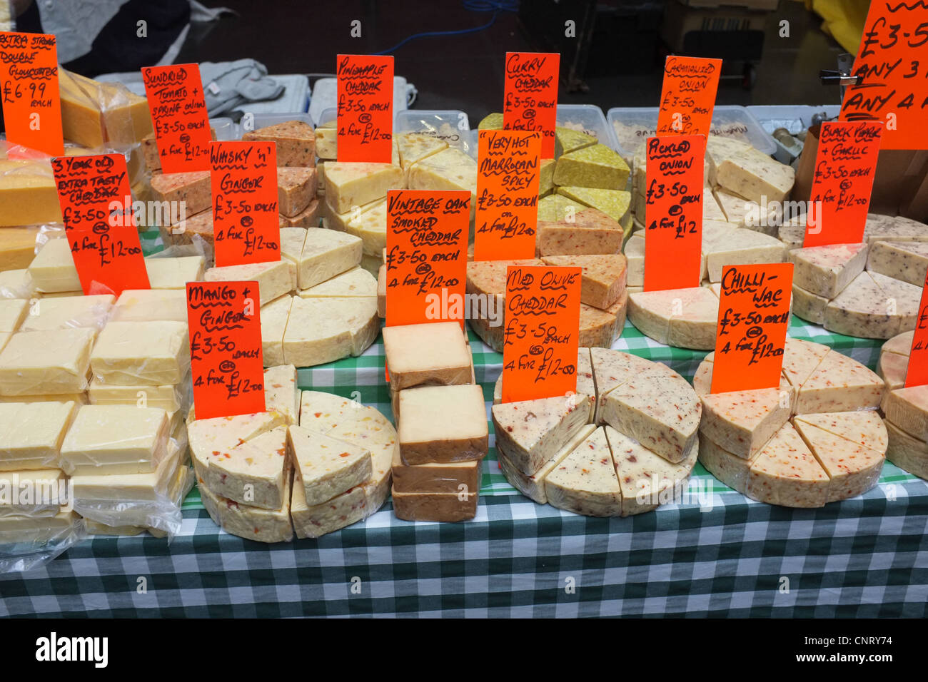 Cheese for sale on a market stall Stock Photo - Alamy