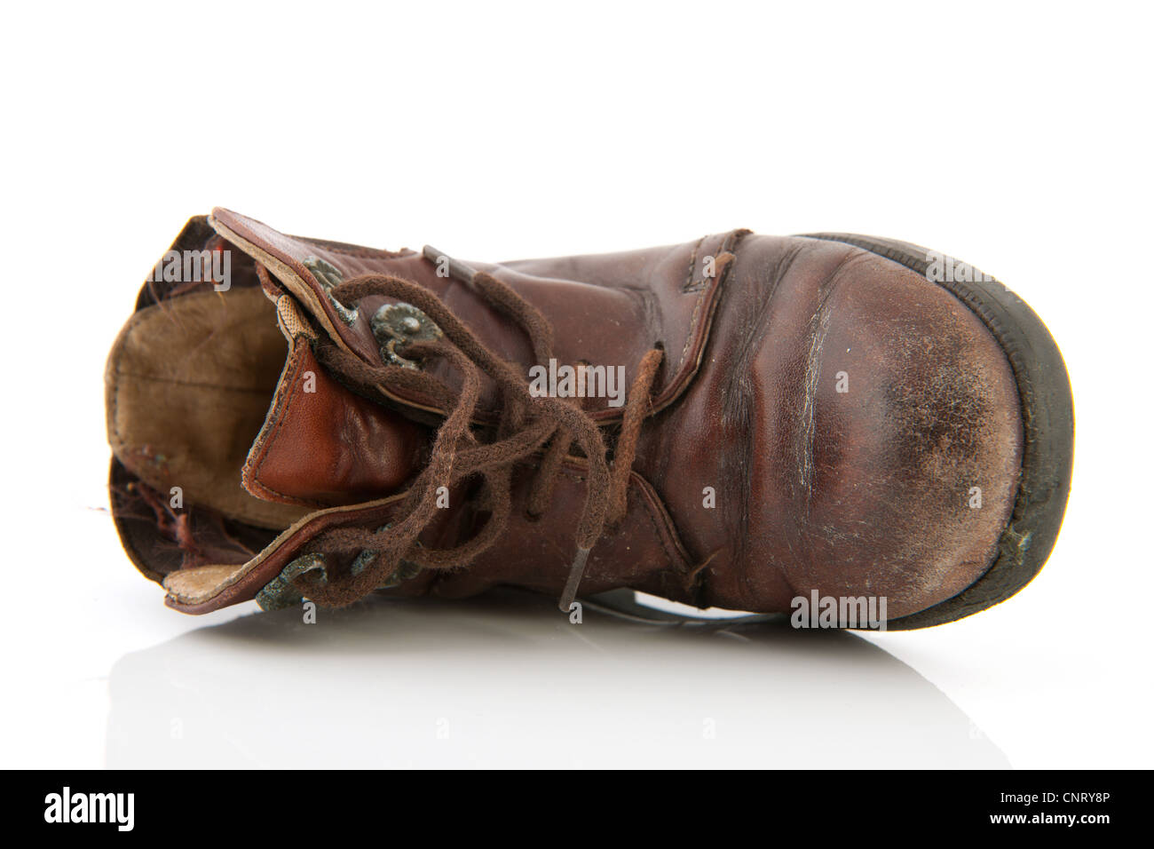 Old brown leather shoe isolated over white background Stock Photo - Alamy