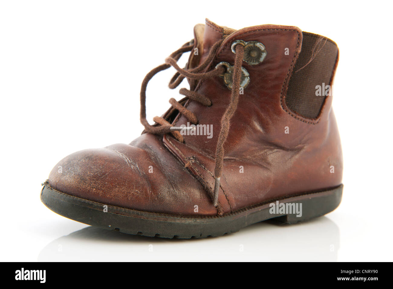Old brown leather shoe isolated over white background Stock Photo - Alamy
