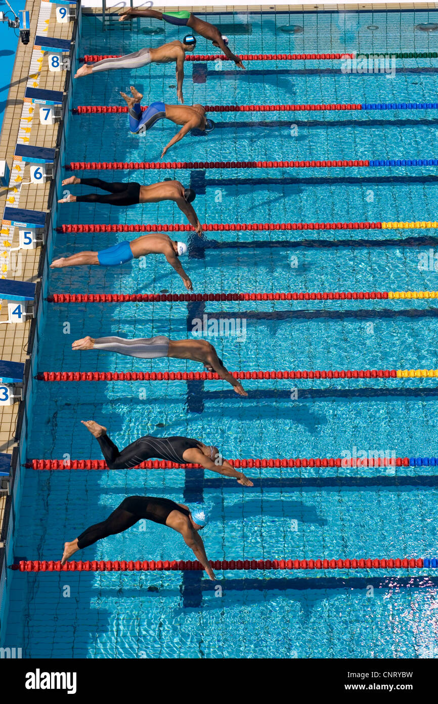 Start of men's swimming race Stock Photo - Alamy
