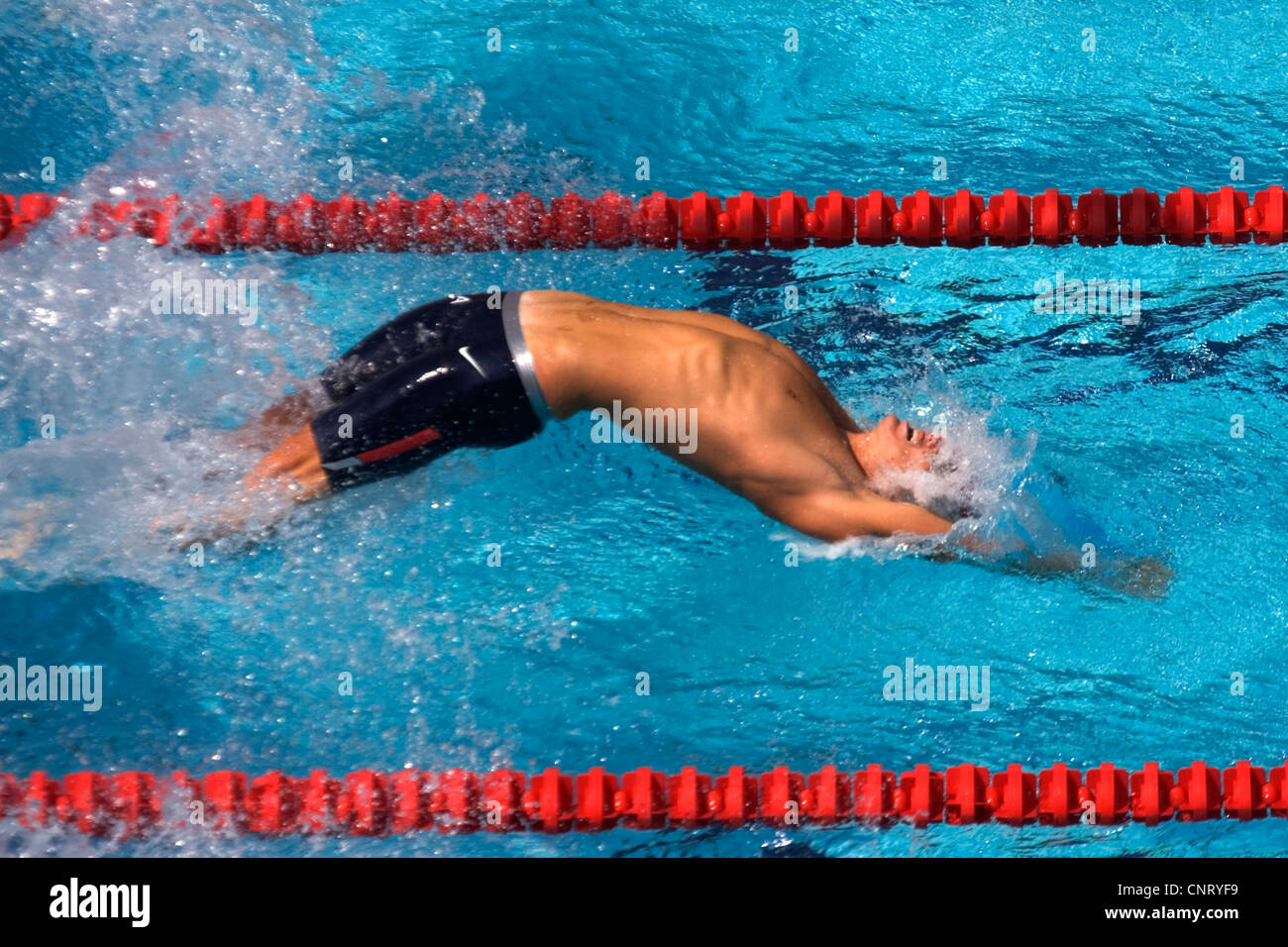 Aaron Peirsol (USA) starting the 100m backstroke heats. 2004 Olympic ...