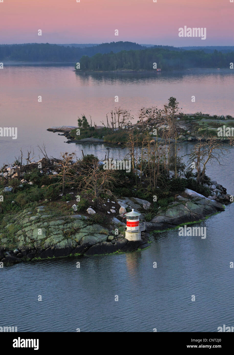Ryssmasterna Lighthouse (Fyr) and dramatic pink hued sunrise with ...