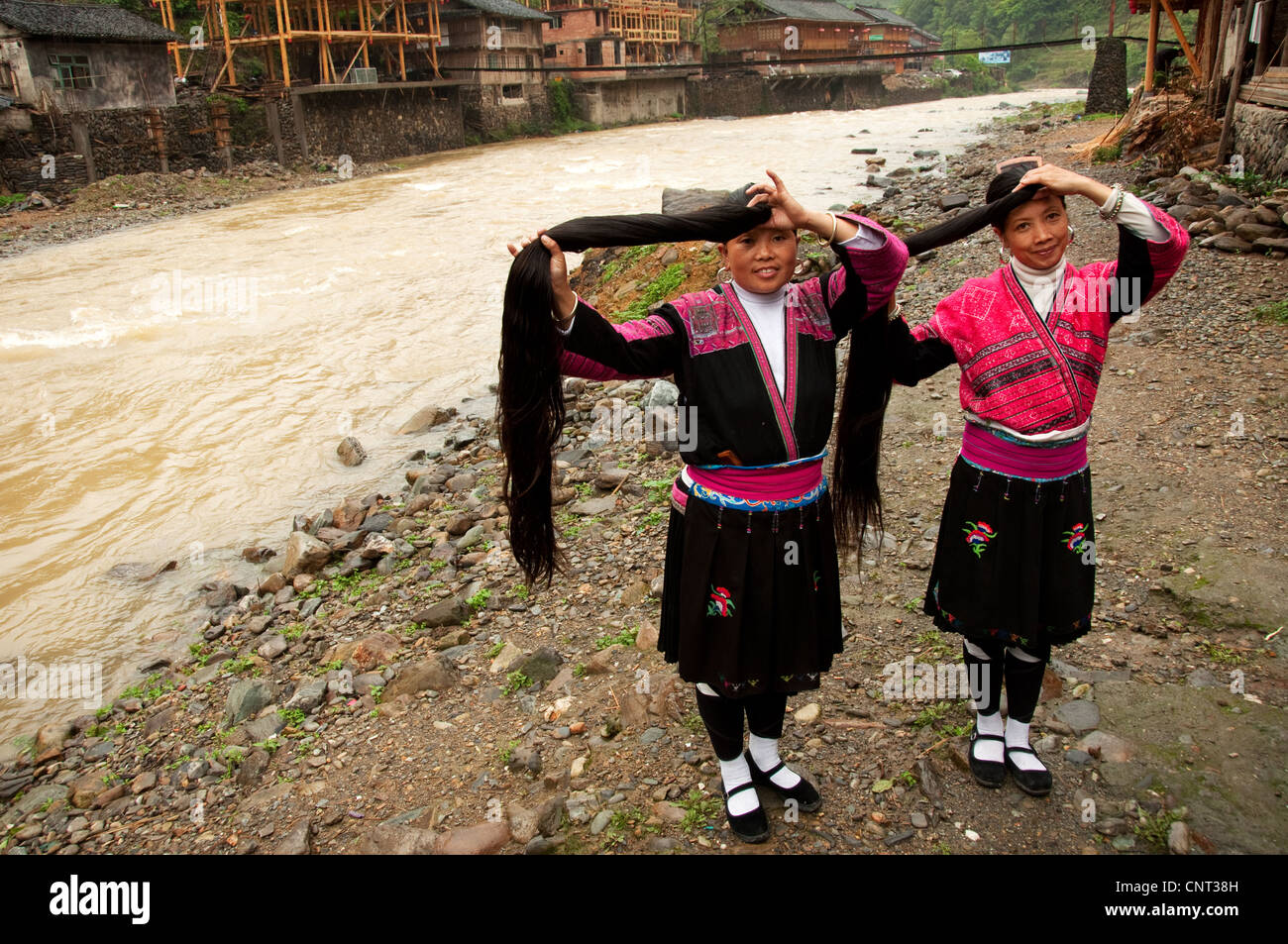 Two Yao women let their hair down, Huangluo Village, Southern China ...