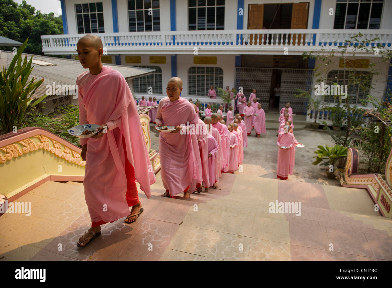 Novice Buddhist nuns entering dining hall at the Sakyadhita Thilashin ...