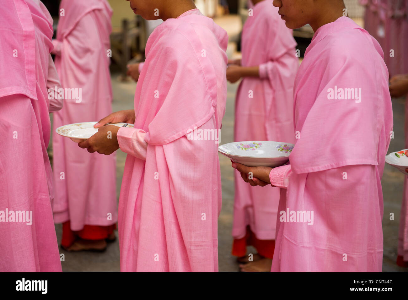 Novice Buddhist nuns entering dining hall at the Sakyadhita Thilashin ...