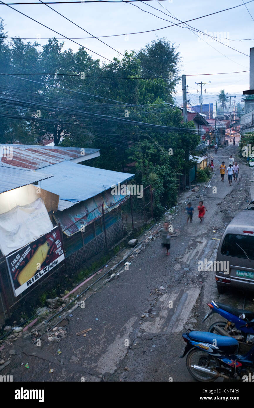 People walking along a sidestreet. Lapu-Lapu City, Metro Cebu, Mactan ...