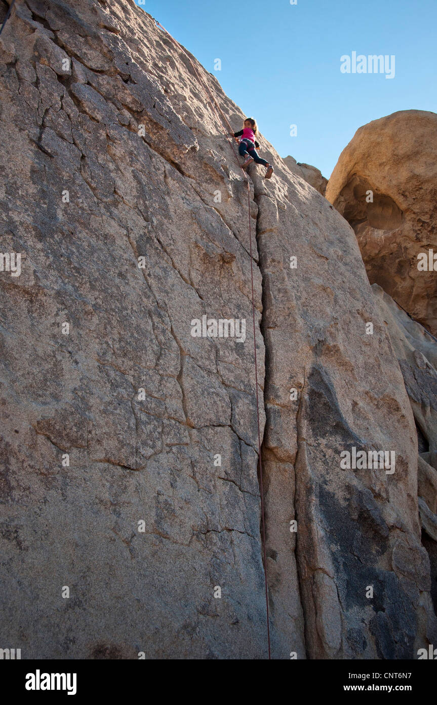 young girl rock climb climbing wall risk sport extreme outdoor nature ...