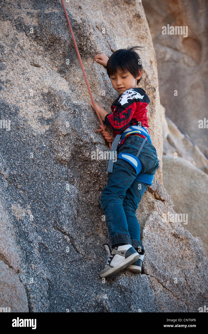 young boy rock climb climbing wall risk sport extreme outdoor nature ...