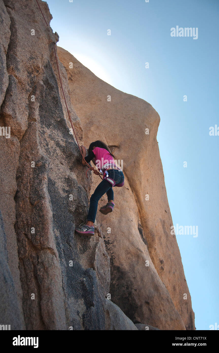 young girl rock climb climbing wall risk sport extreme outdoor nature ...