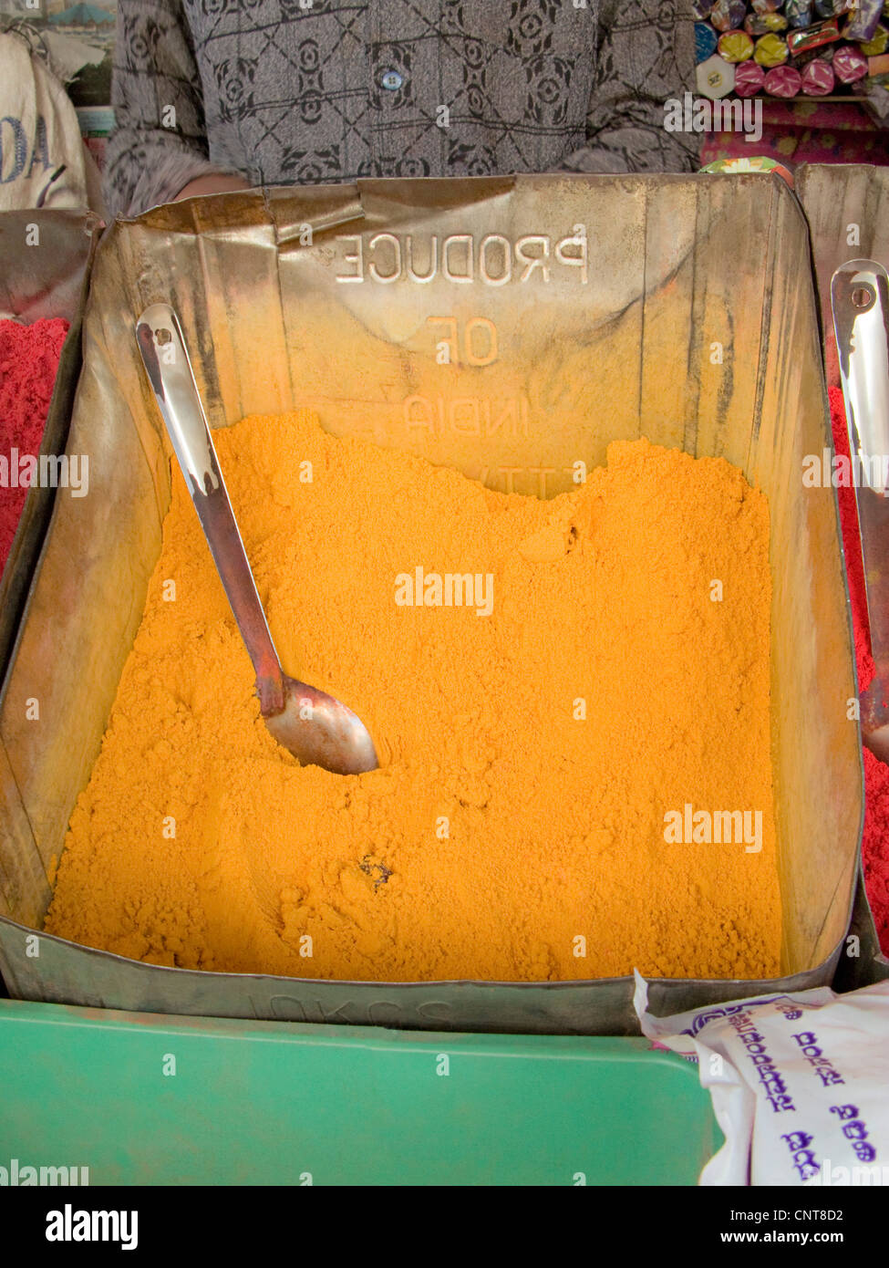 Ground turmeric selling in market Stock Photo - Alamy
