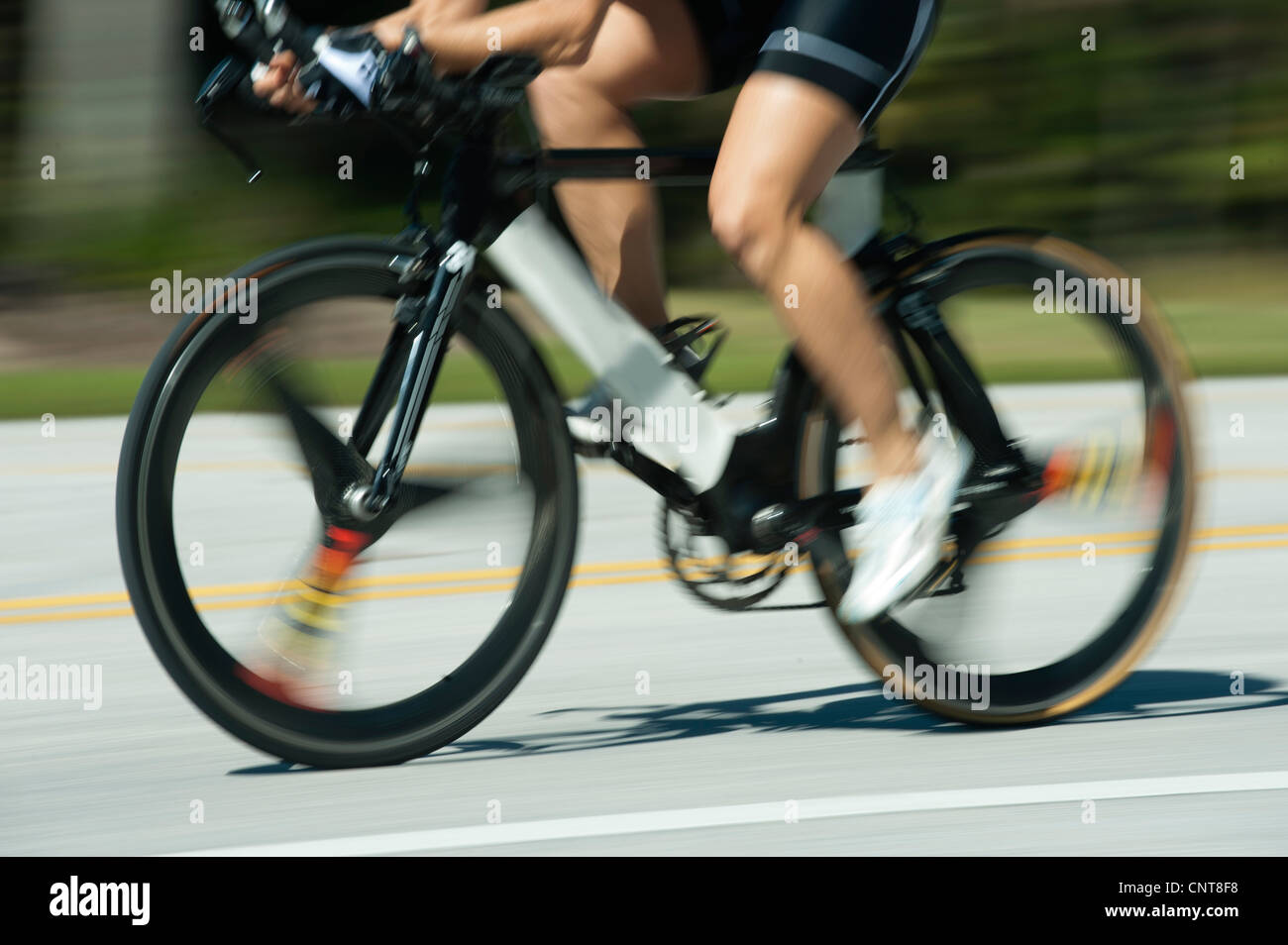 Woman riding road bike low hi-res stock photography and images - Alamy
