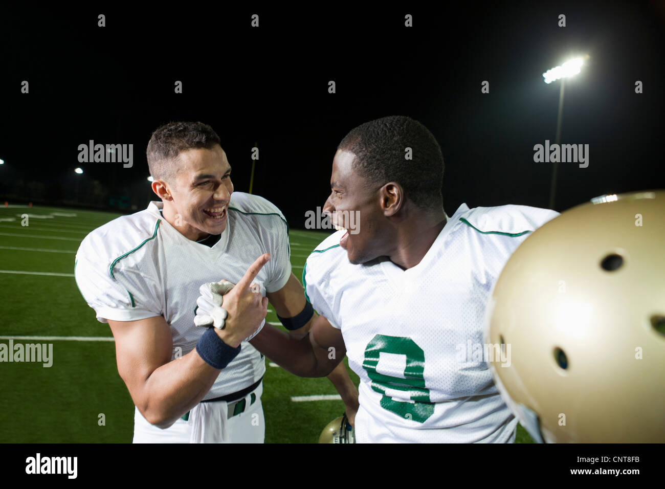 Football players celebrating victory together Stock Photo - Alamy