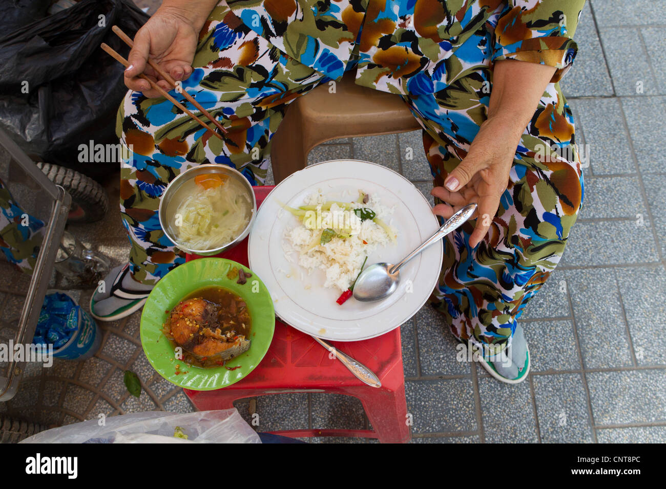 Person eating street food, cropped Stock Photo - Alamy