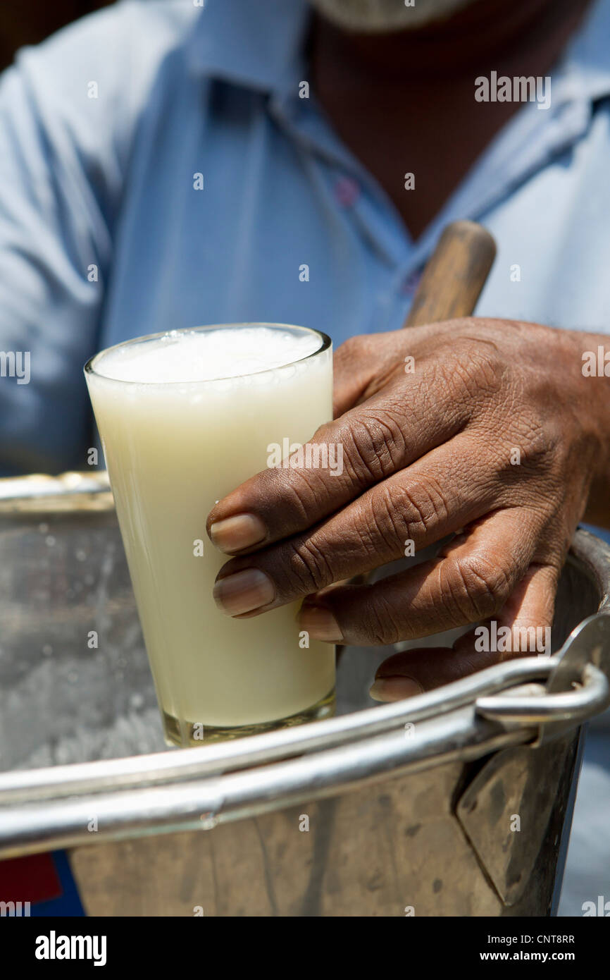 Vendor selling glass of lassi Stock Photo - Alamy