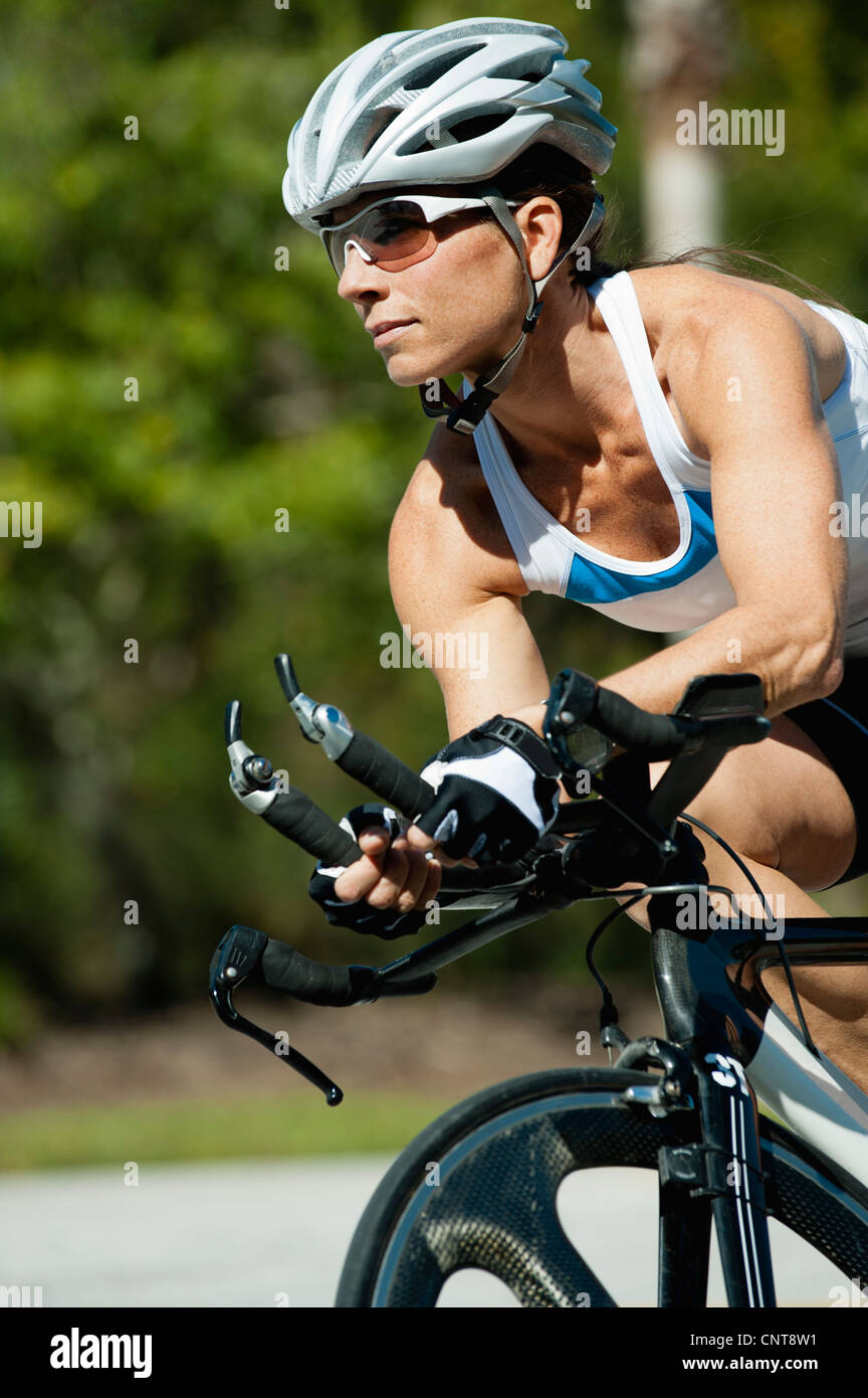 Woman riding road bike, portrait Stock Photo - Alamy