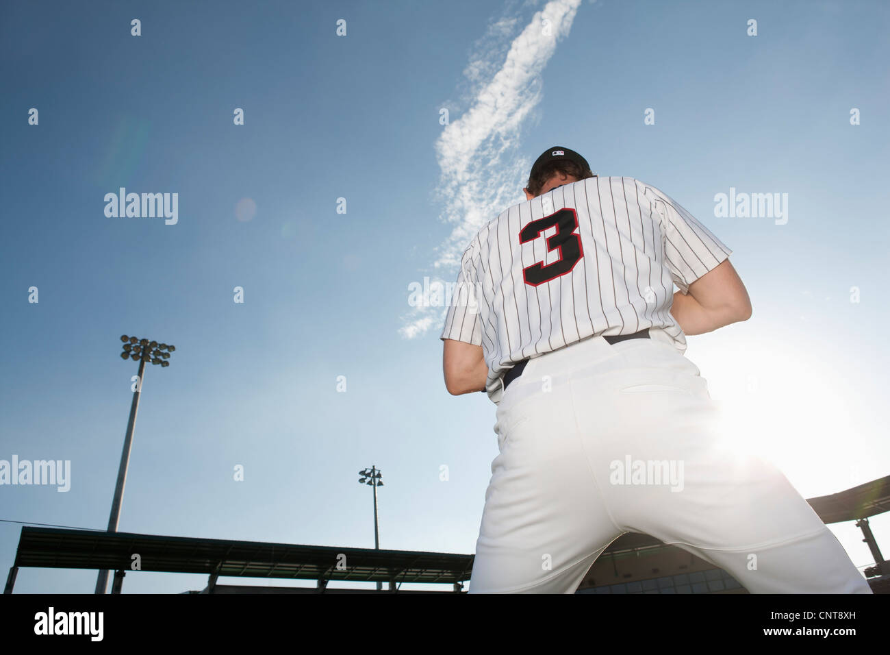Baseball player, rear view Stock Photo - Alamy