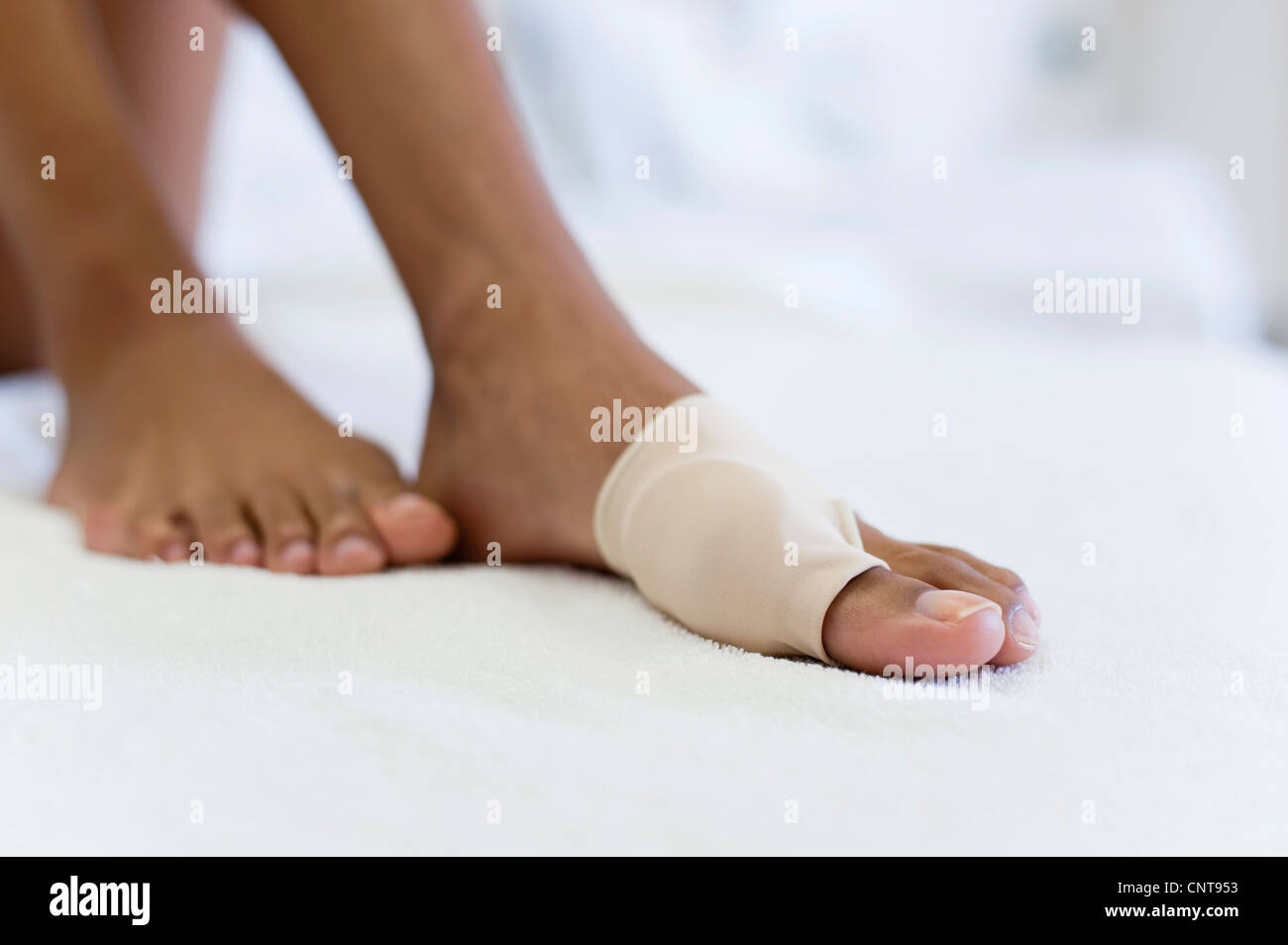 Woman's foot wrapped in brace for injured toe, low section Stock Photo ...