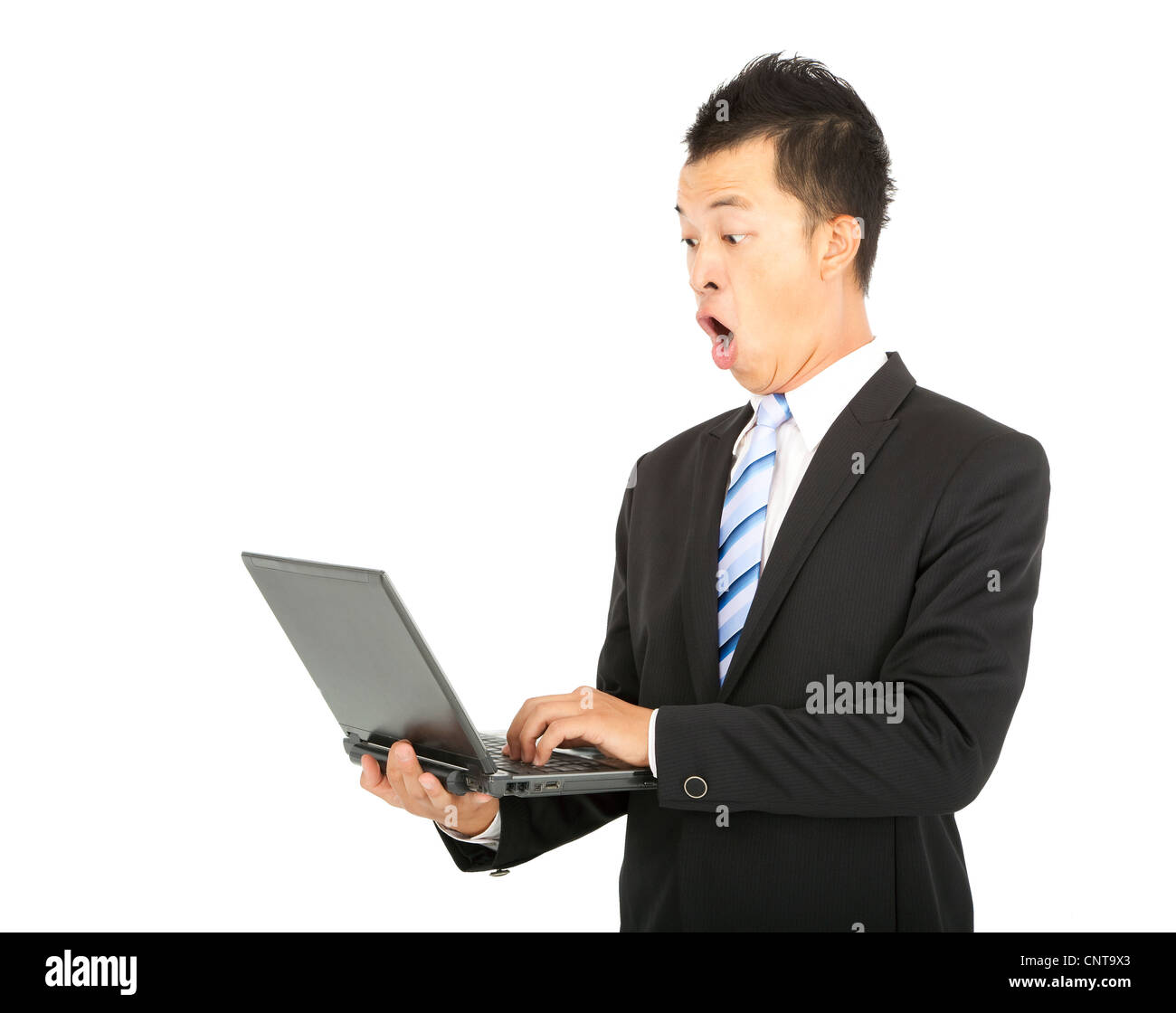 surprised businessman watching the laptop computer Stock Photo - Alamy