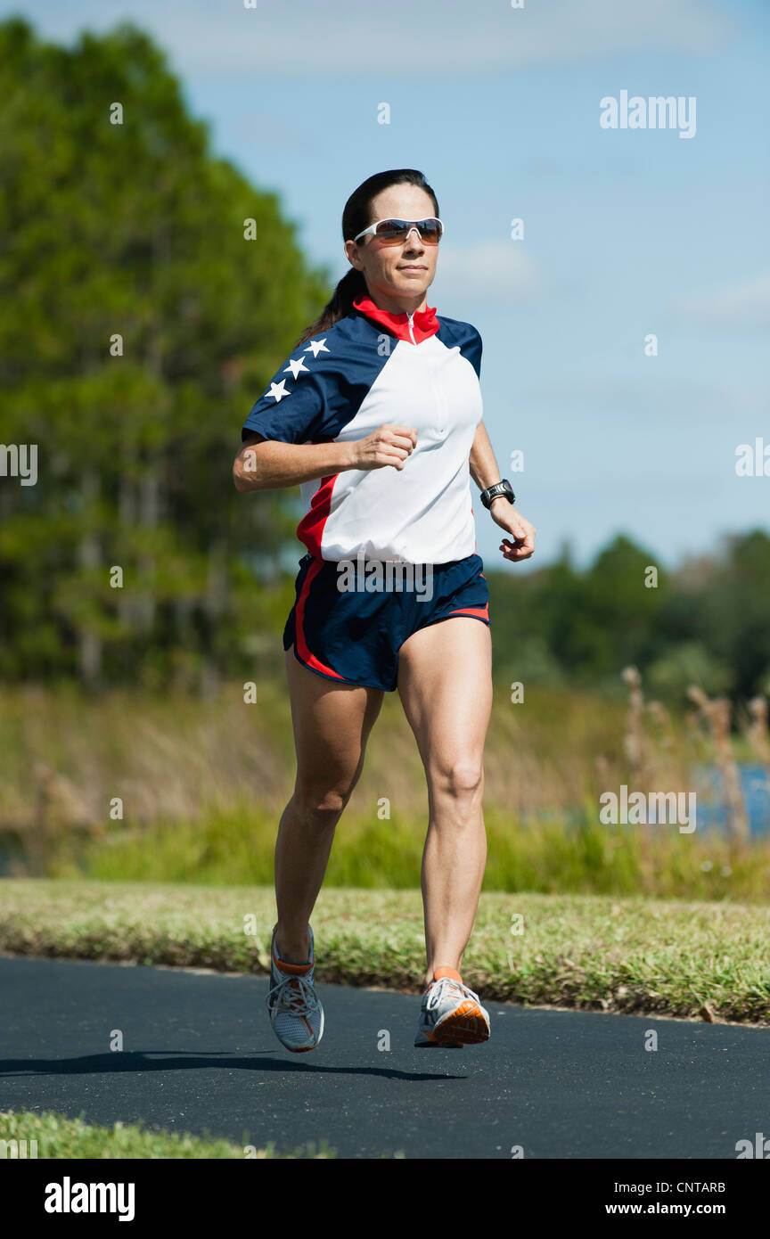 Woman running, portrait Stock Photo - Alamy