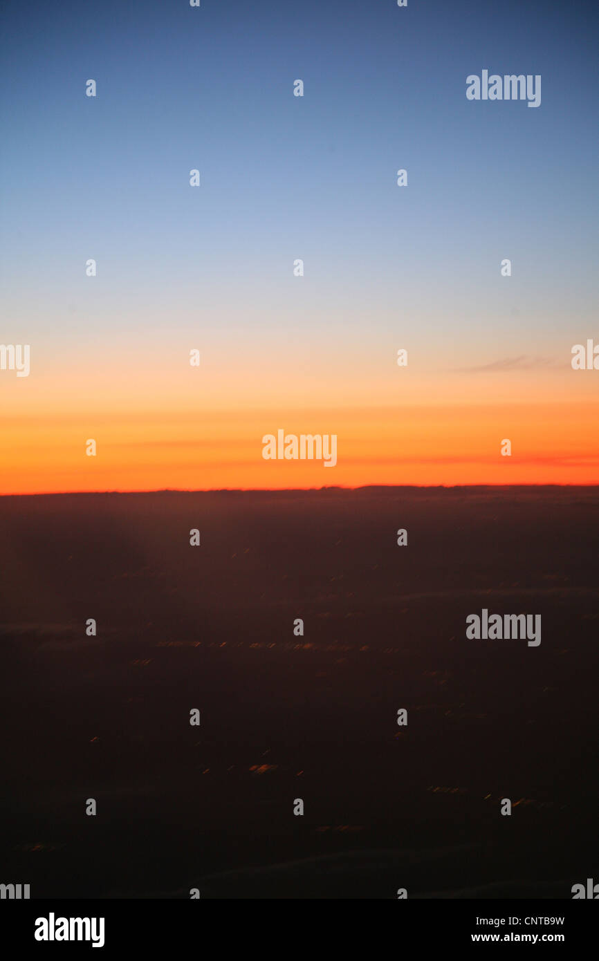 Sunset view out of airplane window Stock Photo - Alamy