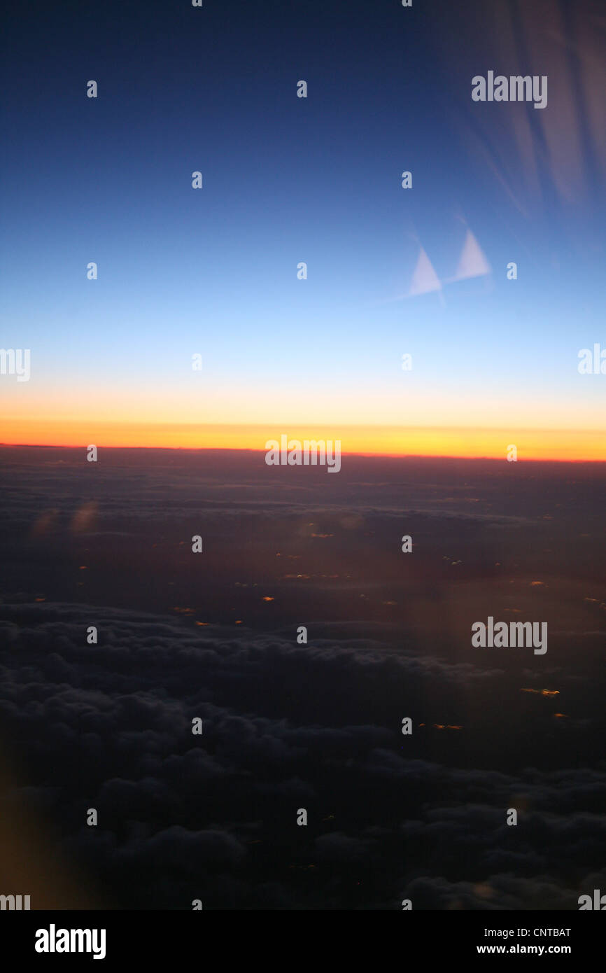 Sunset view out of airplane window Stock Photo - Alamy