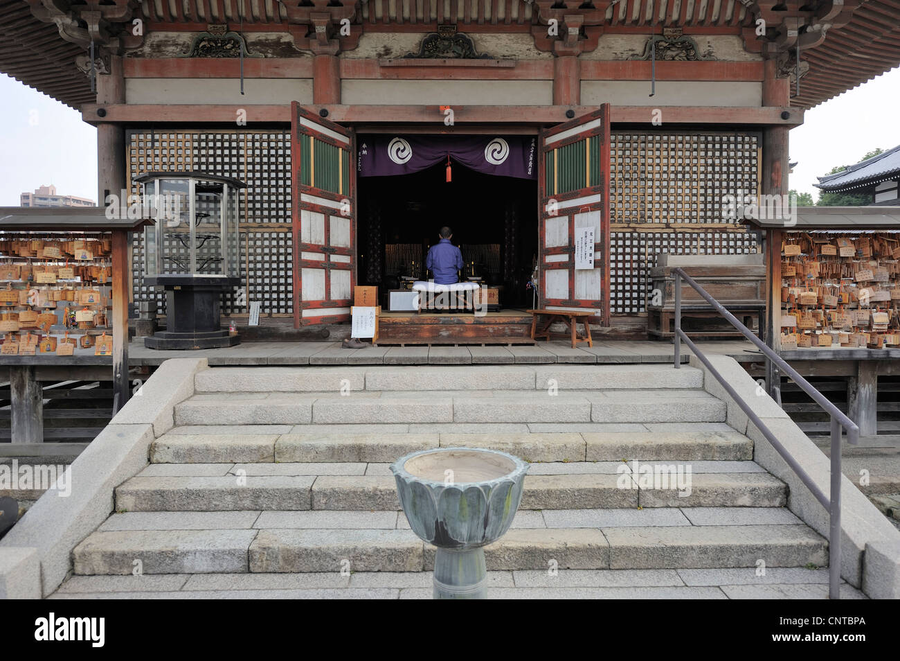 Japanese man sitting on bench in temple, Osaka, Japan Stock Photo - Alamy