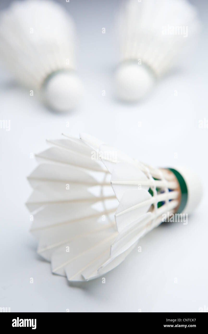 Badminton shuttlecocks on white (color toned image Stock Photo - Alamy