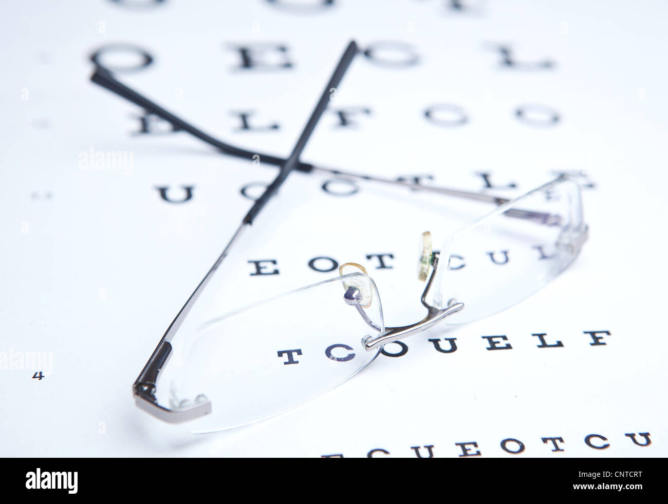 optometry concept - glasses & eye chart Stock Photo - Alamy