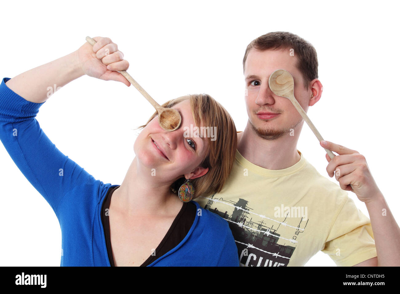 Couple with two wooden spoons on front of her eyes Stock Photo - Alamy