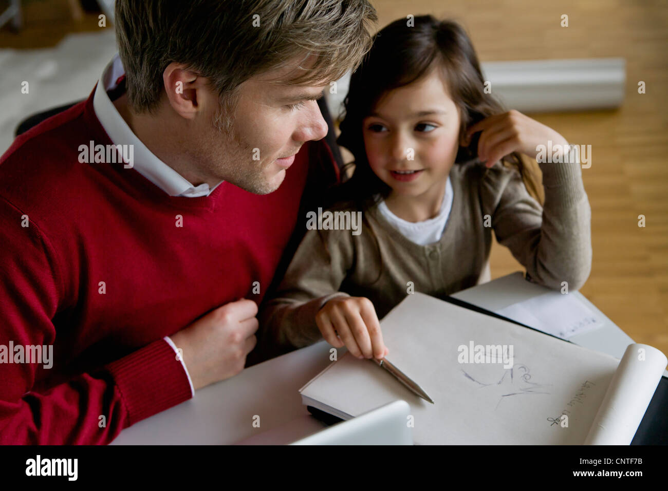 Father helping daughter with homework Stock Photo - Alamy