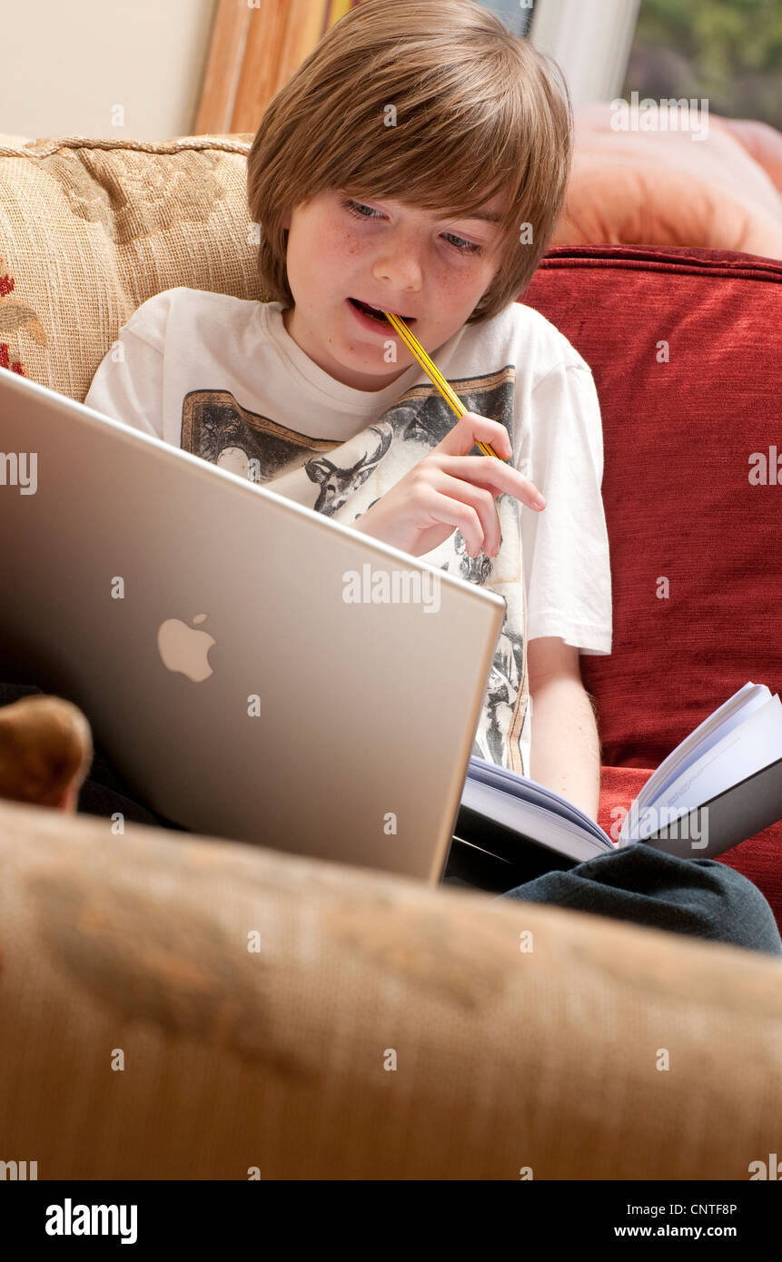 young male boy doing his homework Stock Photo - Alamy