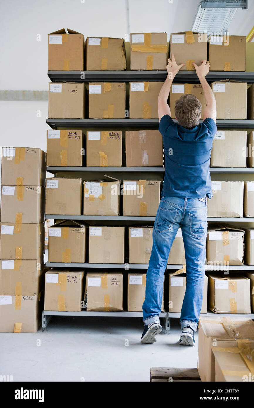 Person reaching shelf storage hi-res stock photography and images - Alamy
