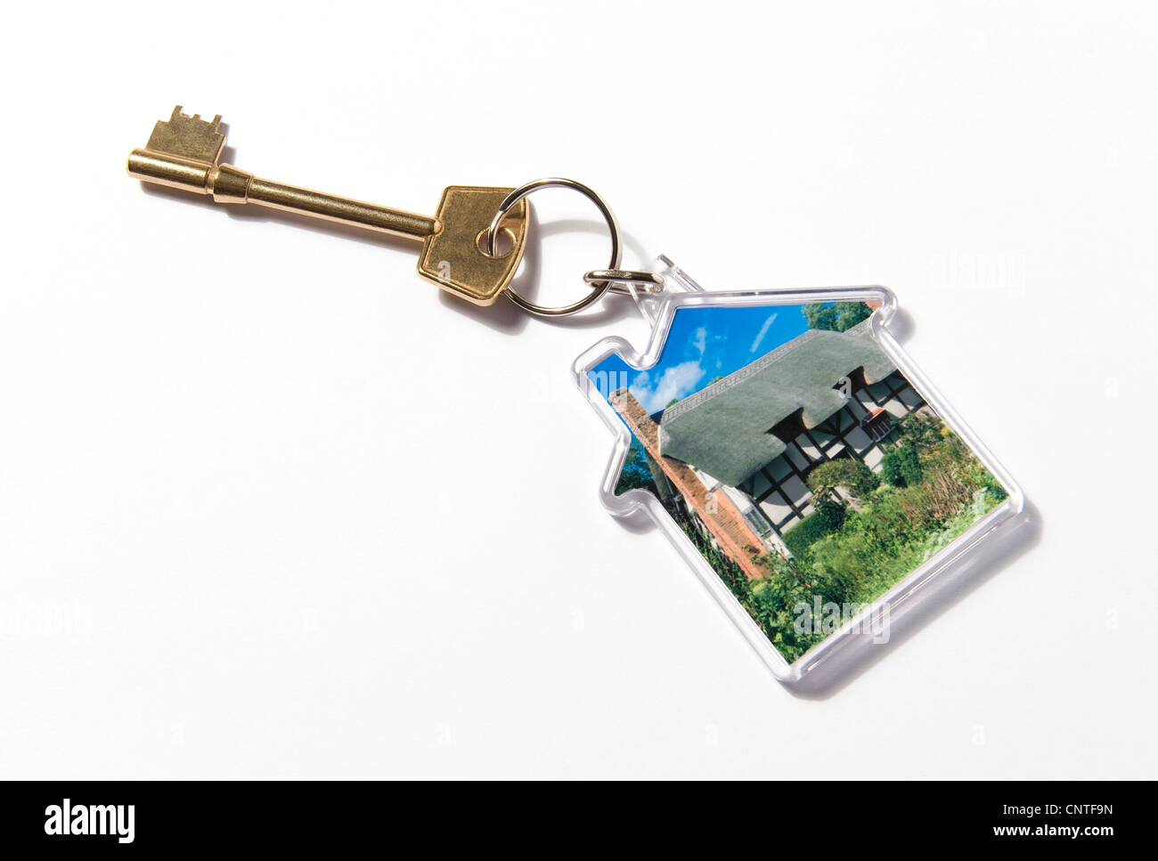 house shaped key ring fob on white background Stock Photo - Alamy
