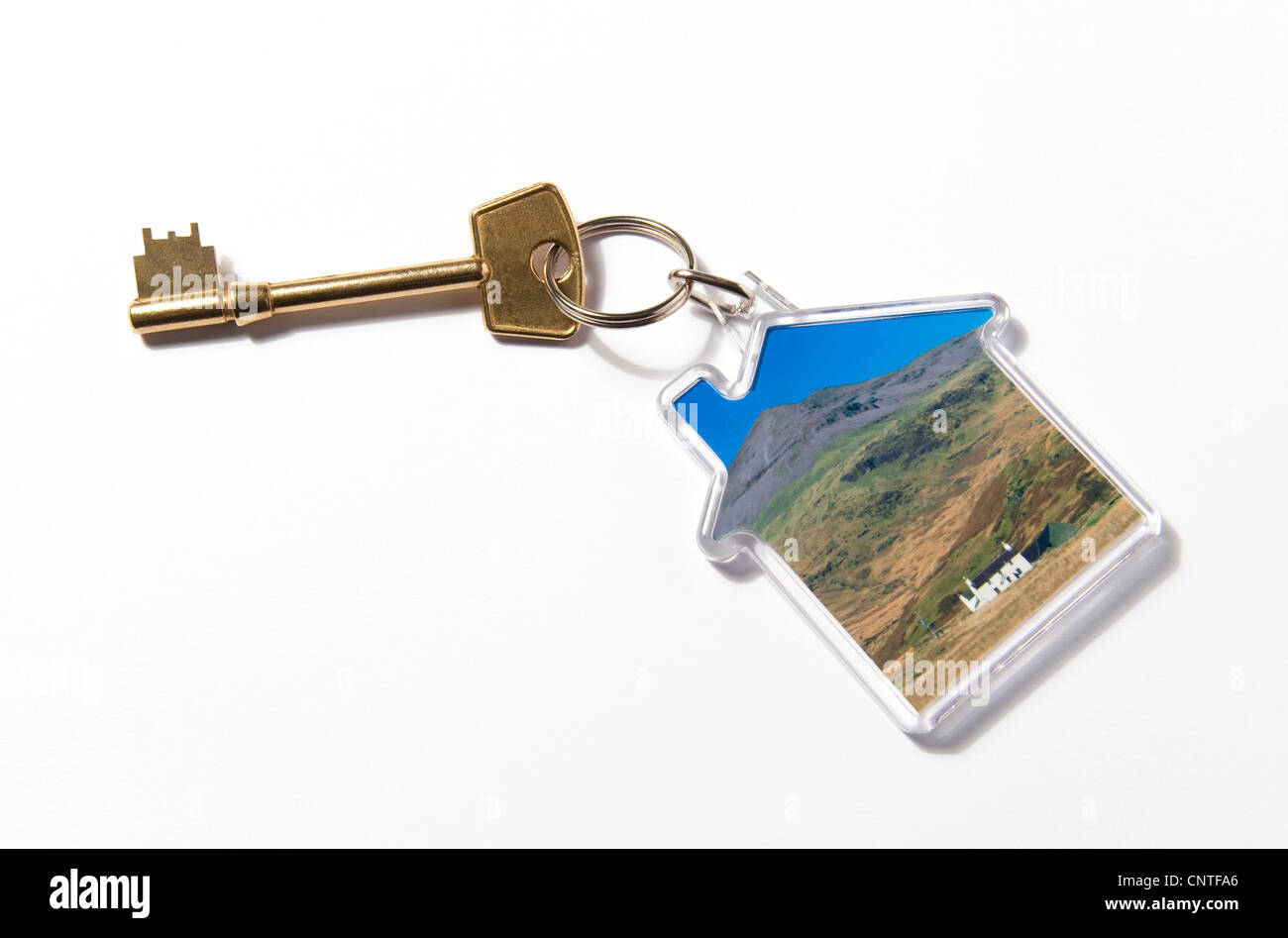 house shaped key ring fob on white background Stock Photo - Alamy