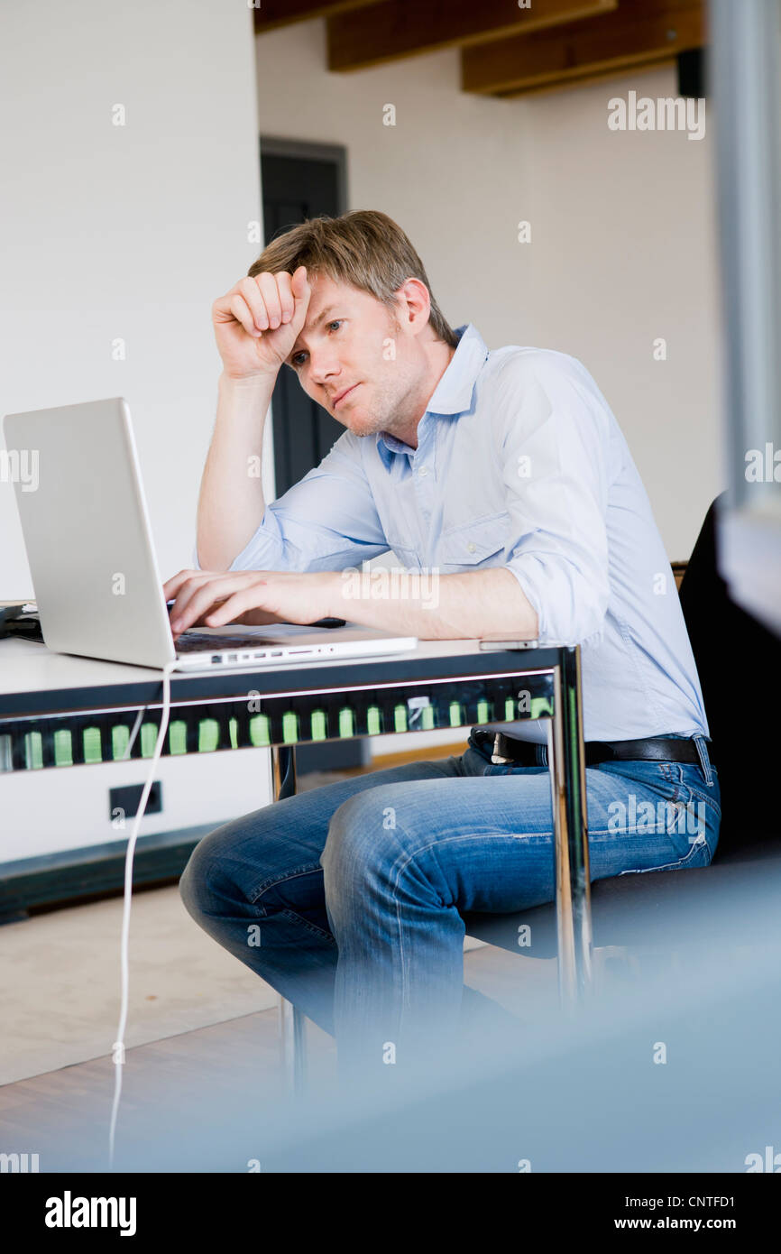 Businessman working on laptop Stock Photo - Alamy