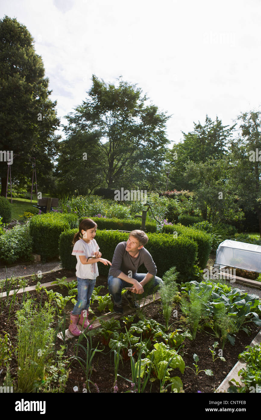 Father and daughter gardening together Stock Photo - Alamy